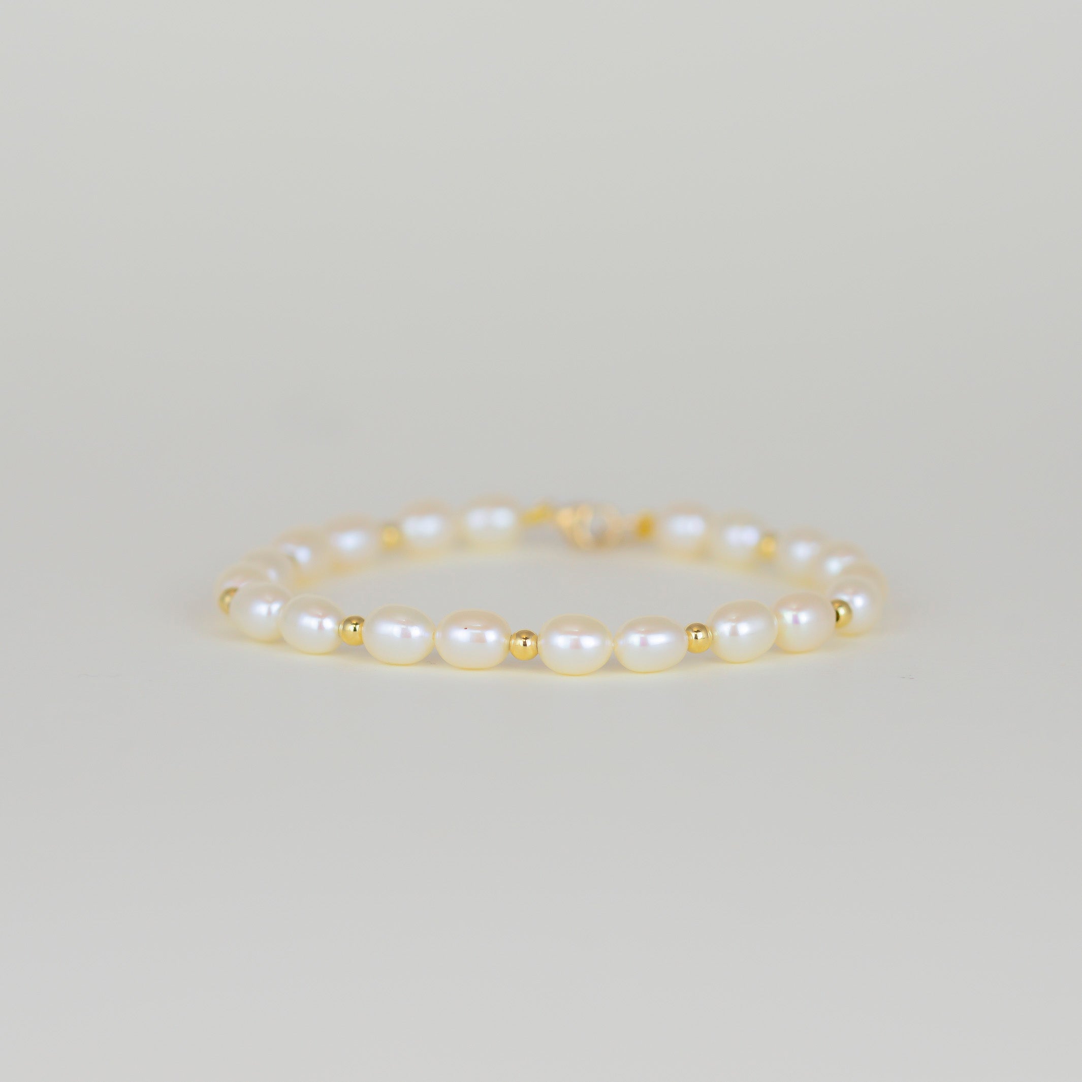 9ct Yellow Gold 6mm Oval Freshwater Pearl Gold Bead Bracelet